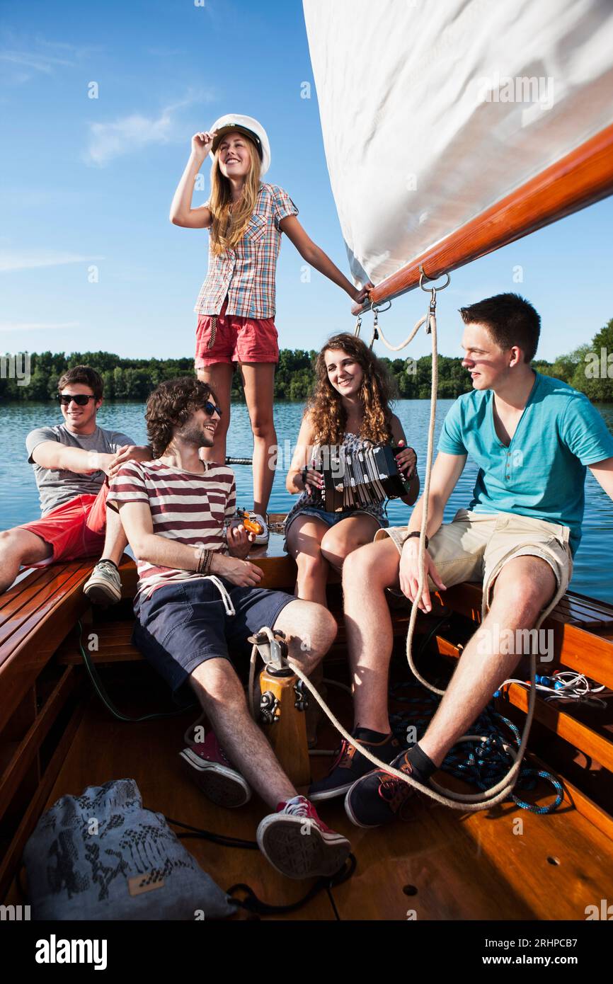 Young people sailing Stock Photo - Alamy