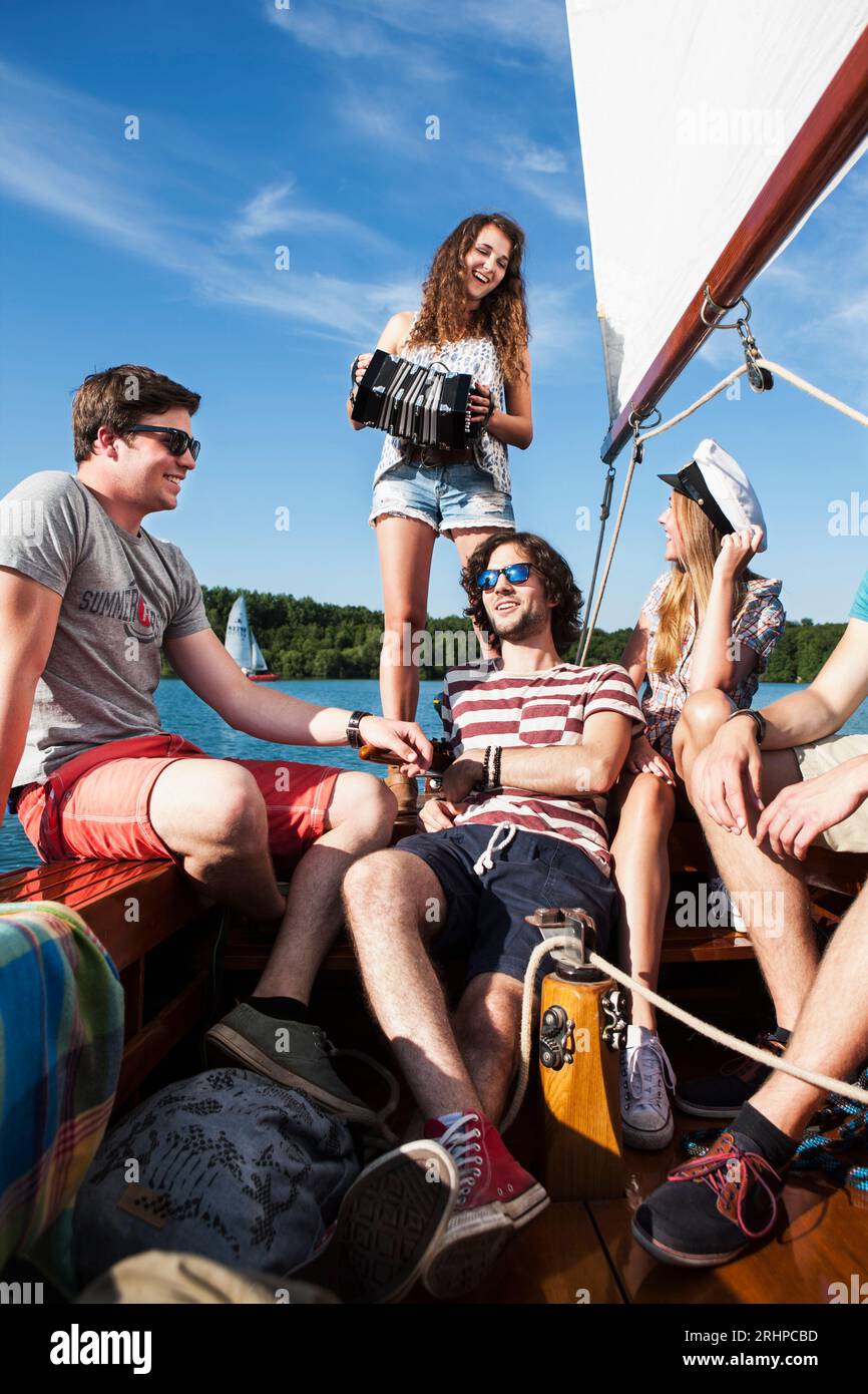 Young people sailing Stock Photo - Alamy
