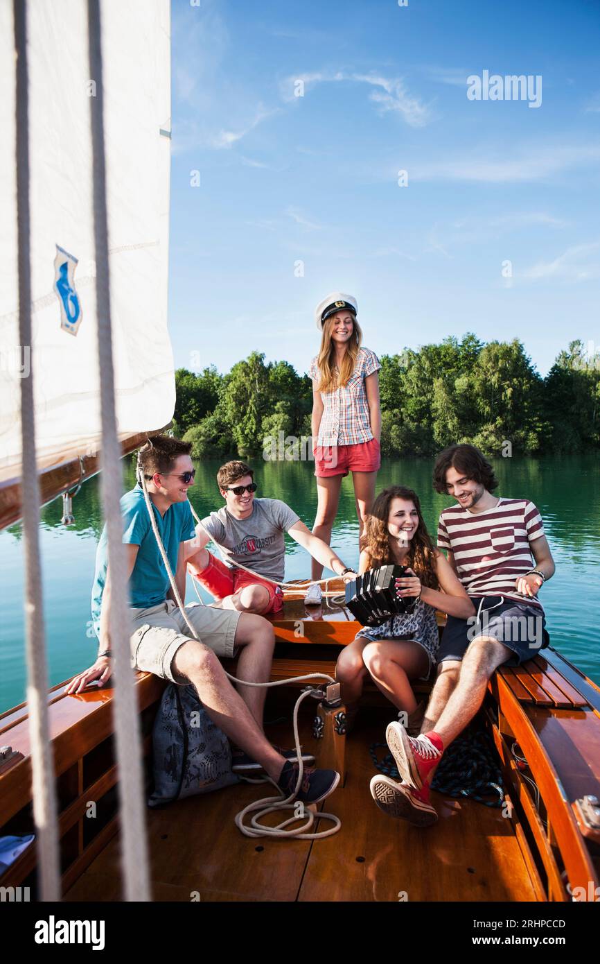 Young people sailing Stock Photo - Alamy