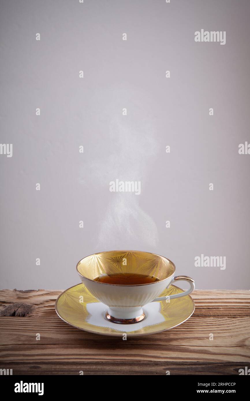 Cup with steaming tea Stock Photo - Alamy
