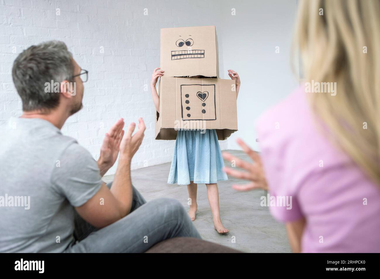 Girl dressed as cardboard monster Stock Photo - Alamy