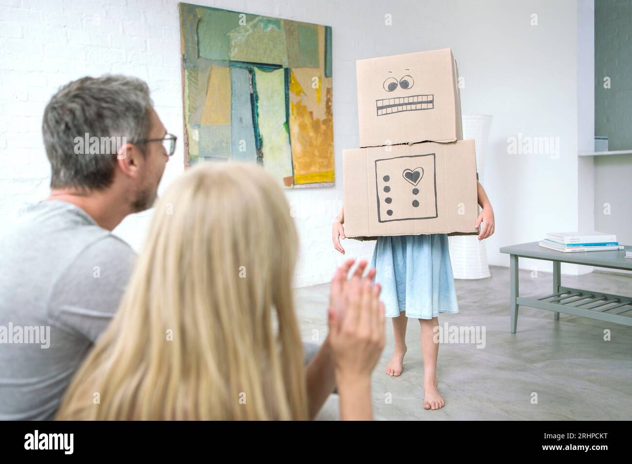 Girl dressed as cardboard monster Stock Photo - Alamy