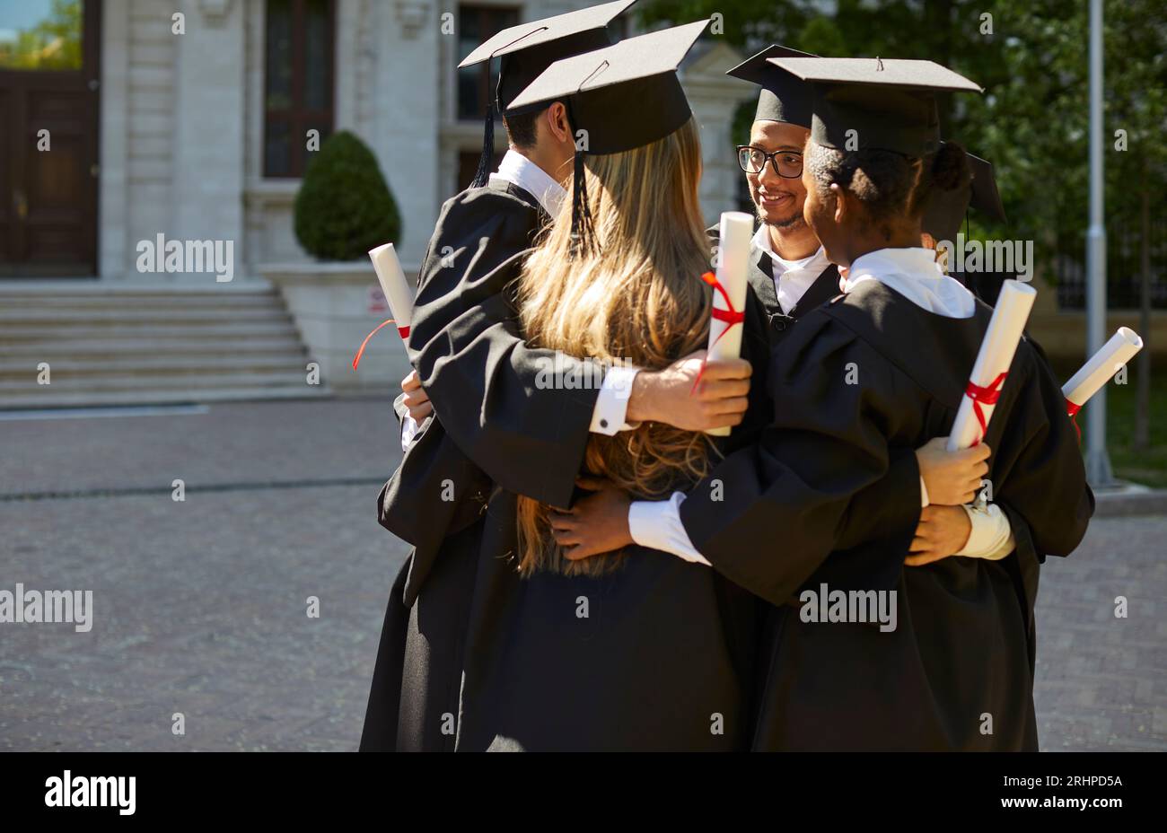 Diversity group of happy graduates celebrating graduation at university ...