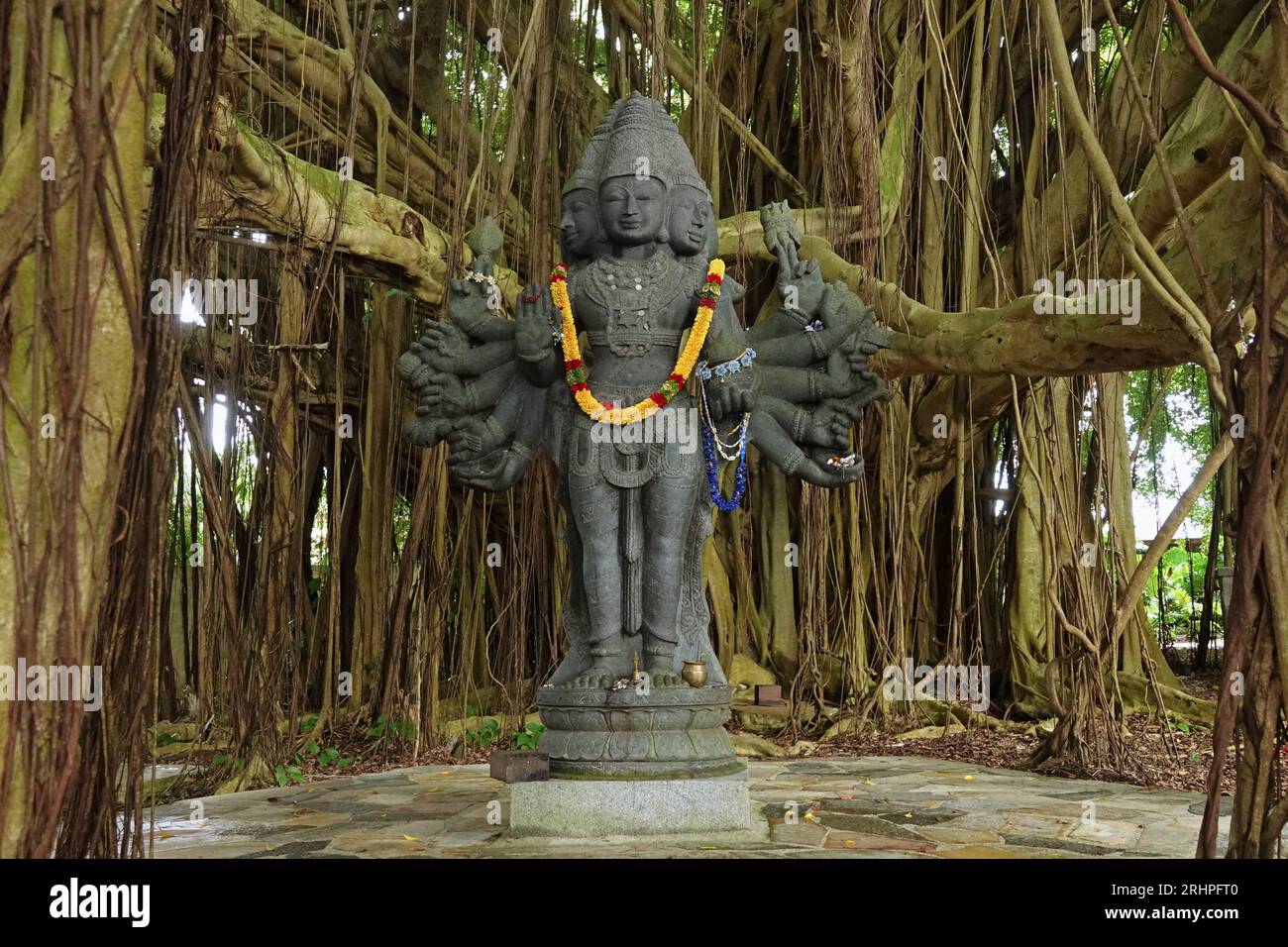 The Lord Shanmuga granite statue, featuring six faces and twelve arms ...