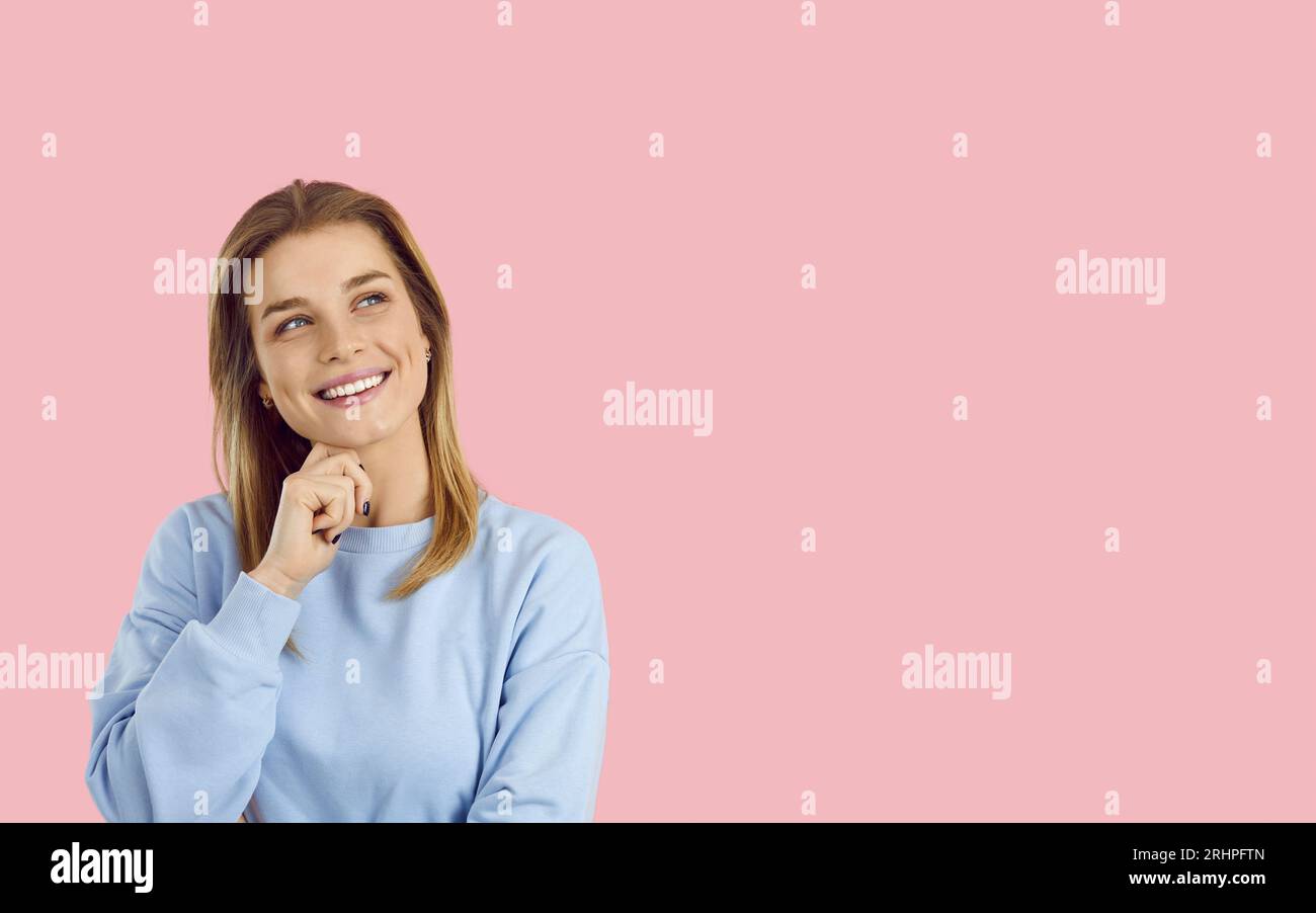 Smiling woman with pensive and dreamy facial expression isolated on ...