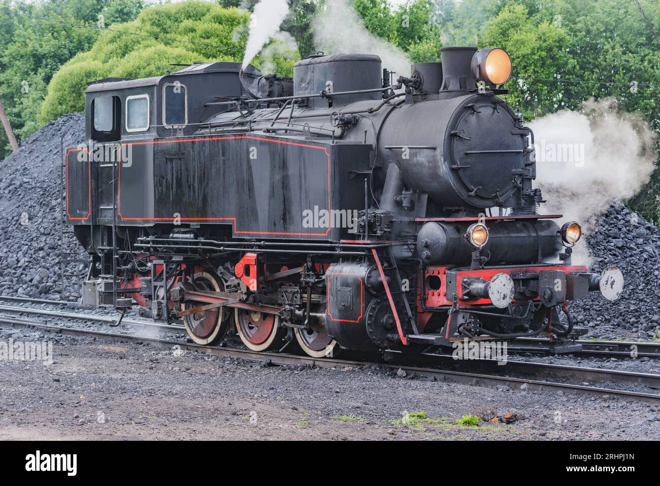 Retro steam locomotive stands near depot Stock Photo - Alamy