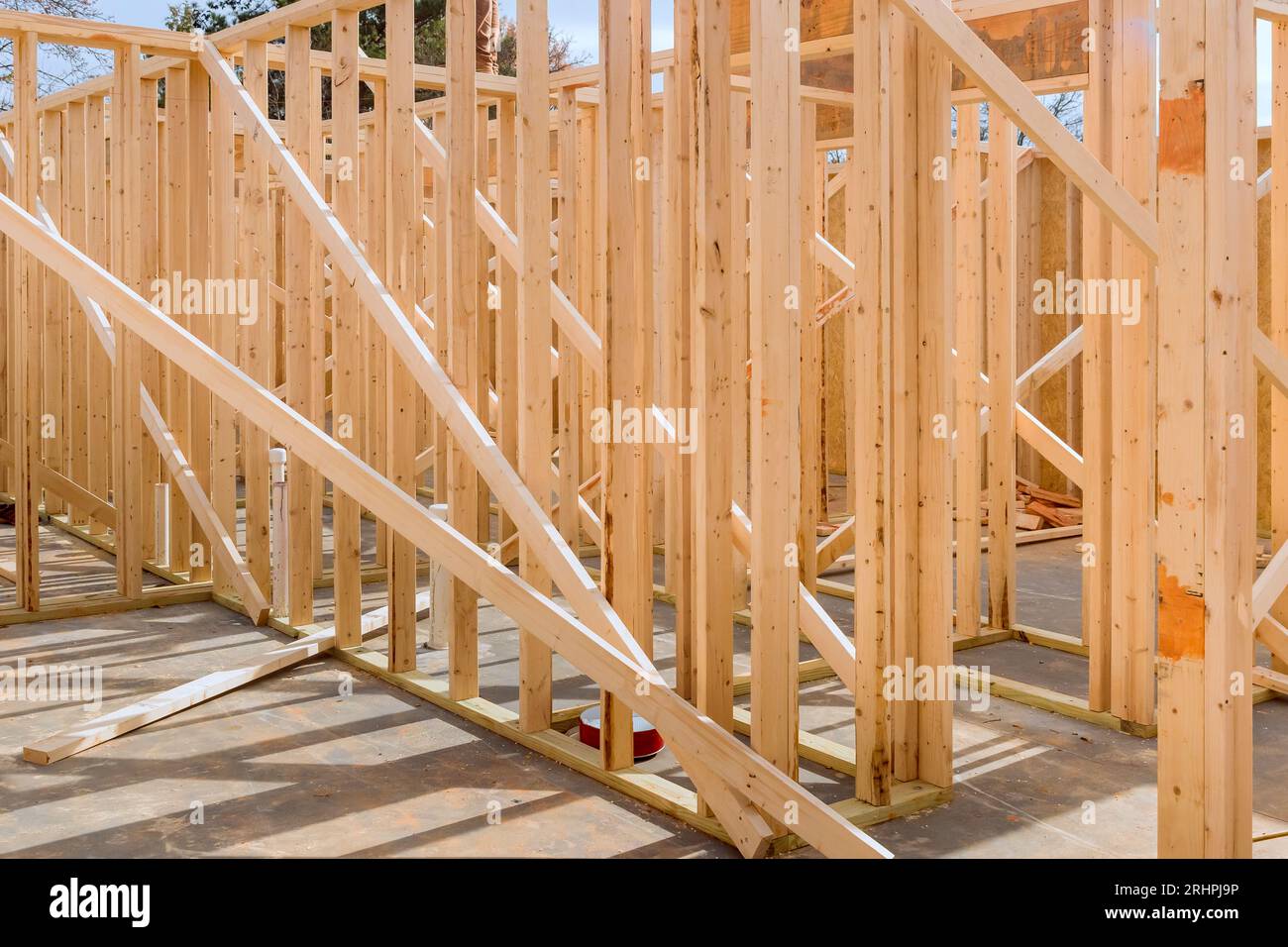 House with wooden framework frame is being constructed with support ...