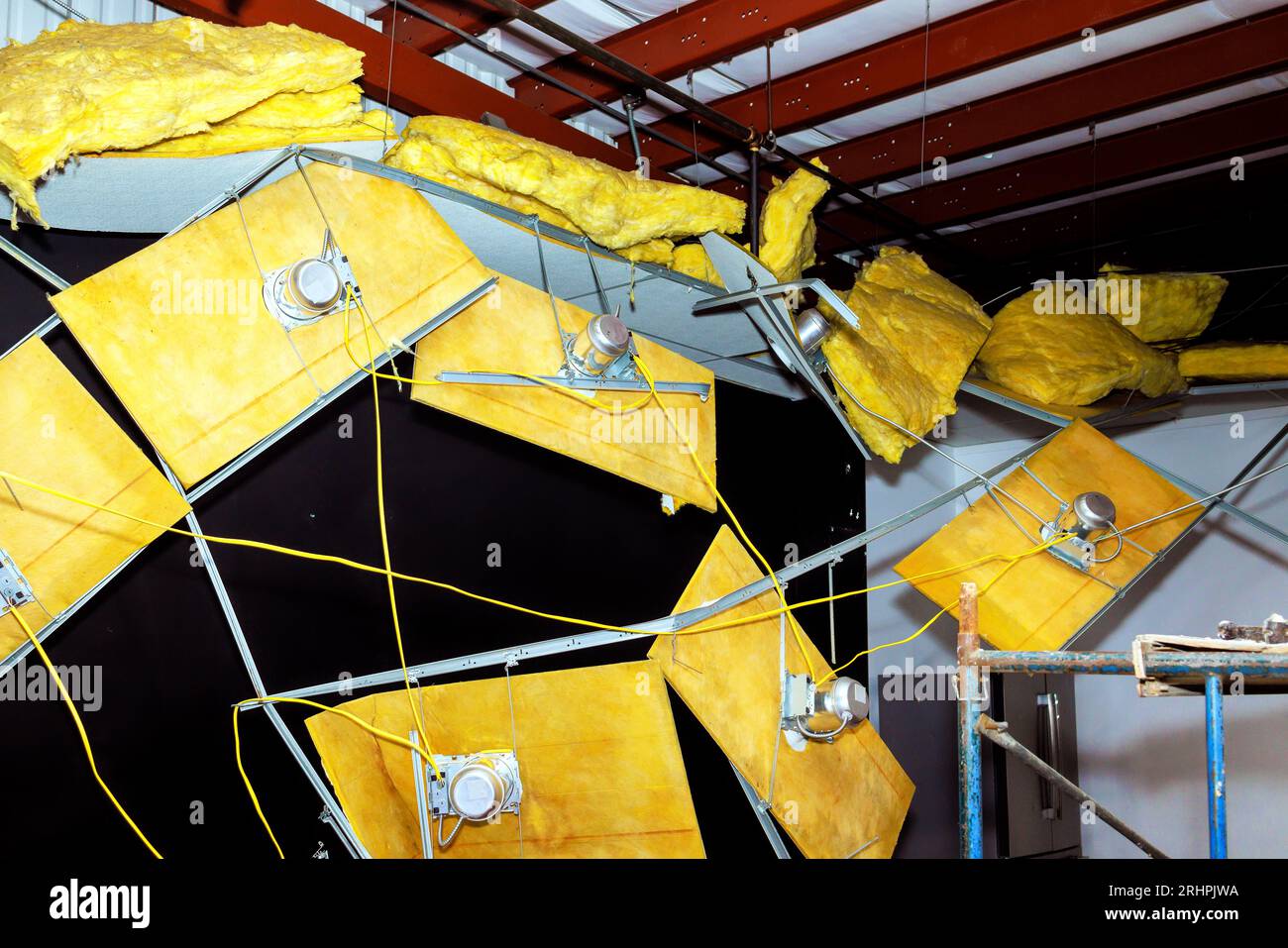 During reconstruction, old ceiling is dismantled within construction ...