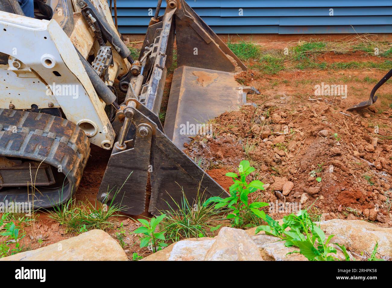 With its mini bulldozer effectively tackle landscaping project ...