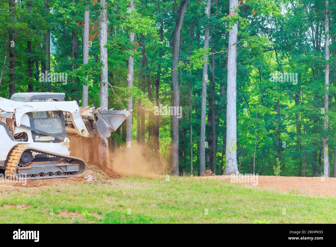 Bulldozer is used for moving ground while performing landscaping works ...
