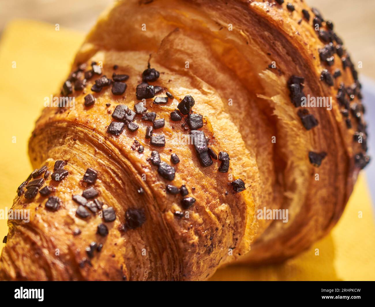 A chocolate croissant, sometimes called a cornetto in Italy Stock Photo ...