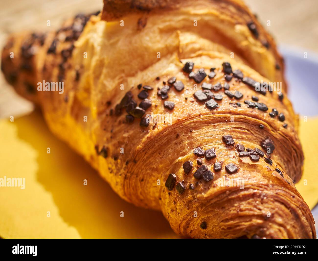 A chocolate croissant, sometimes called a cornetto in Italy Stock Photo ...