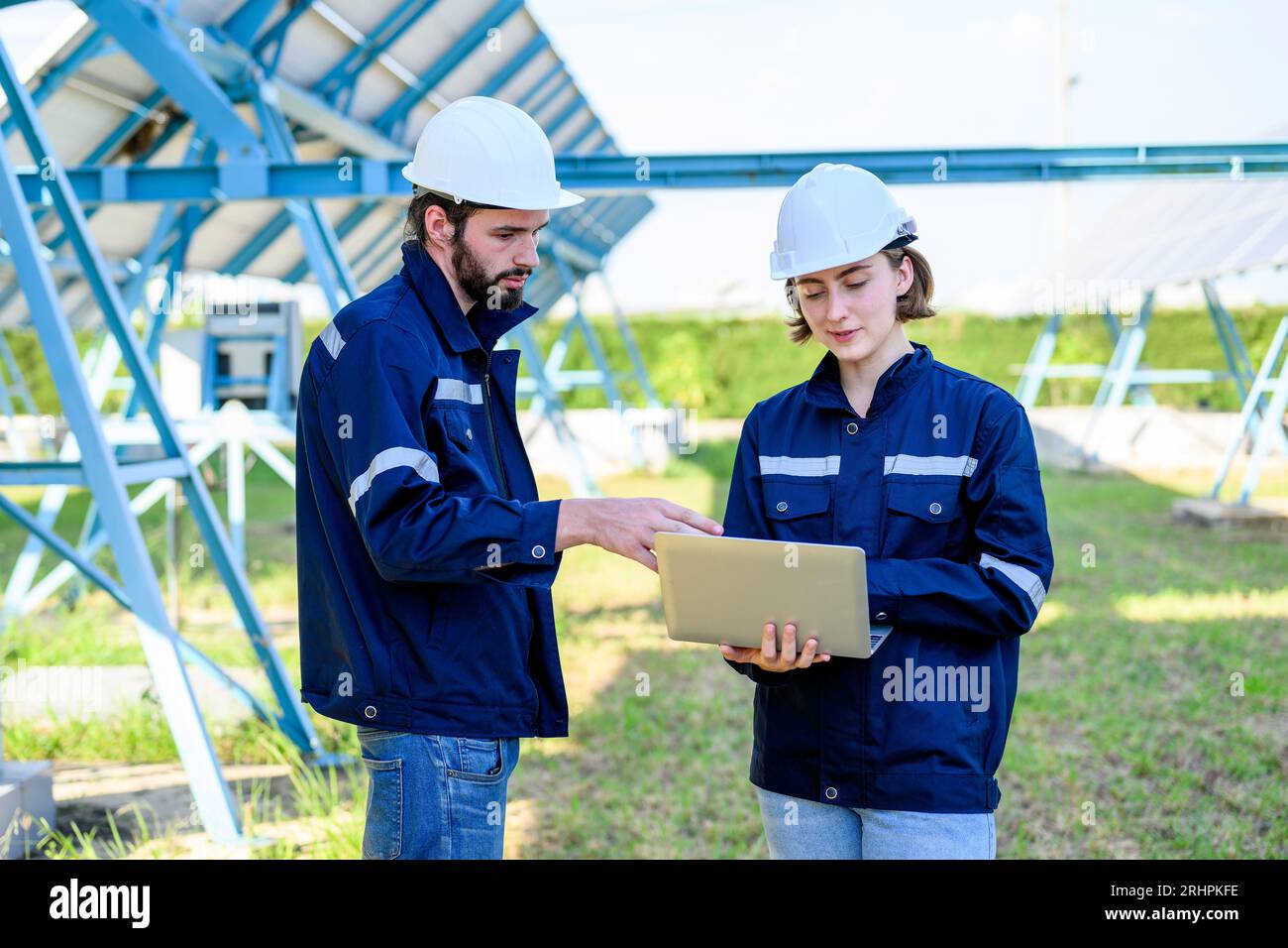 Professional engineers working together at solar power station Stock ...