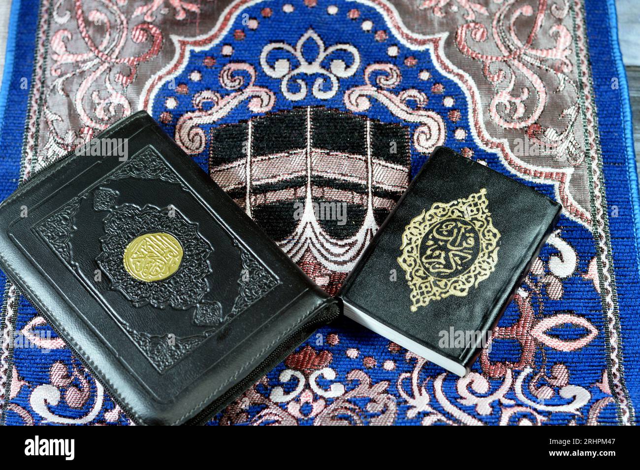 A prayer rug and The Noble Quran, prayer mat is a piece of fabric ...