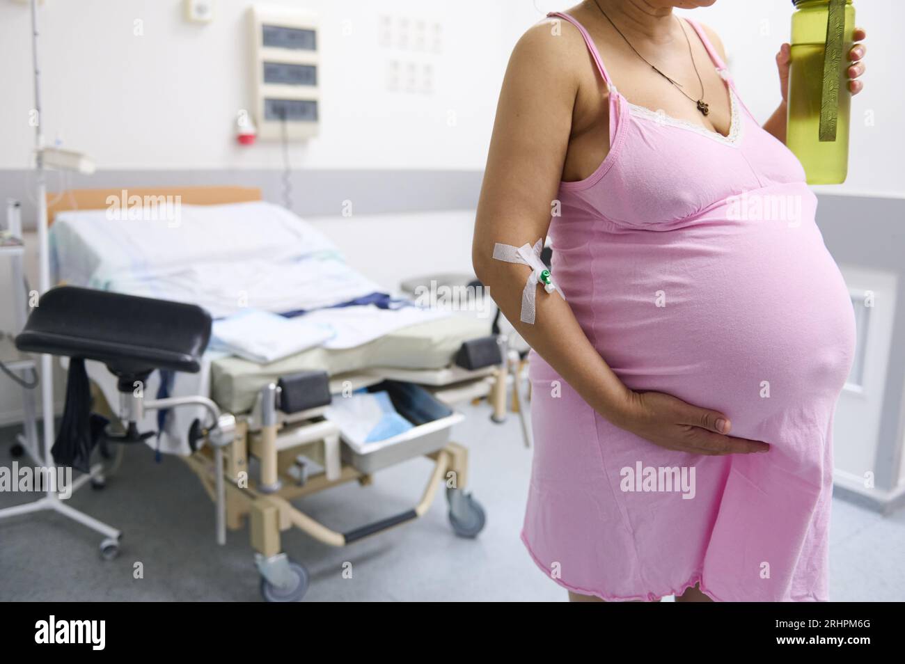 Close-up view. Pregnant woman, birthing mother in delivery room ...