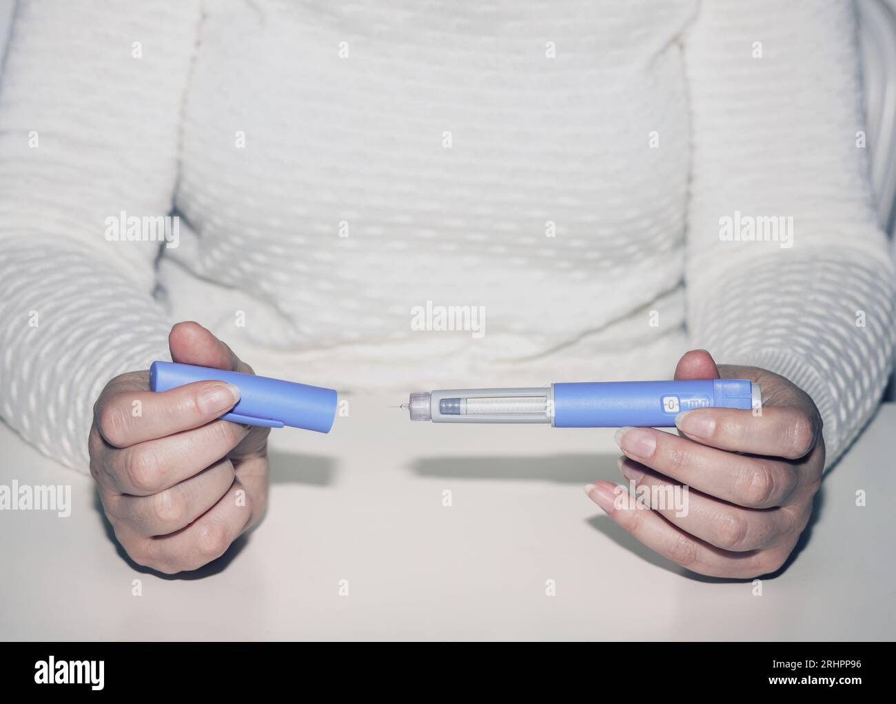 Female hands holding an insulin pen. Ozempic Insulin injection pen or ...