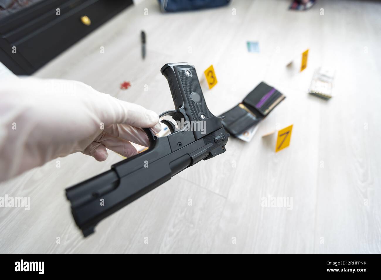 Crime scene investigation - collecting bullet of pistol on the ground ...