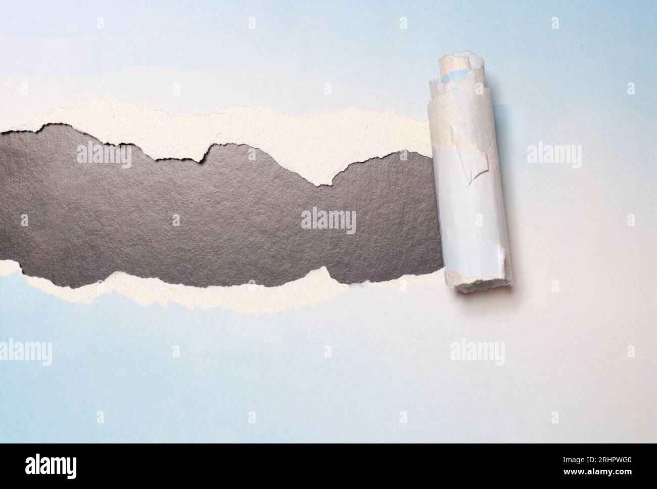 Torn paper with opening showing black background Stock Photo - Alamy