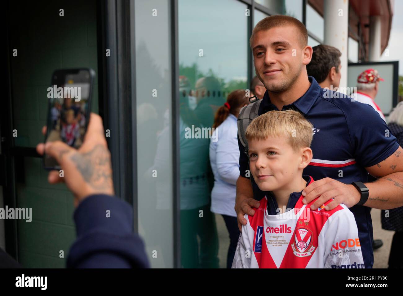 Mikey Lewis #20 of Hull KR poses for a photo with a fan the Betfred ...