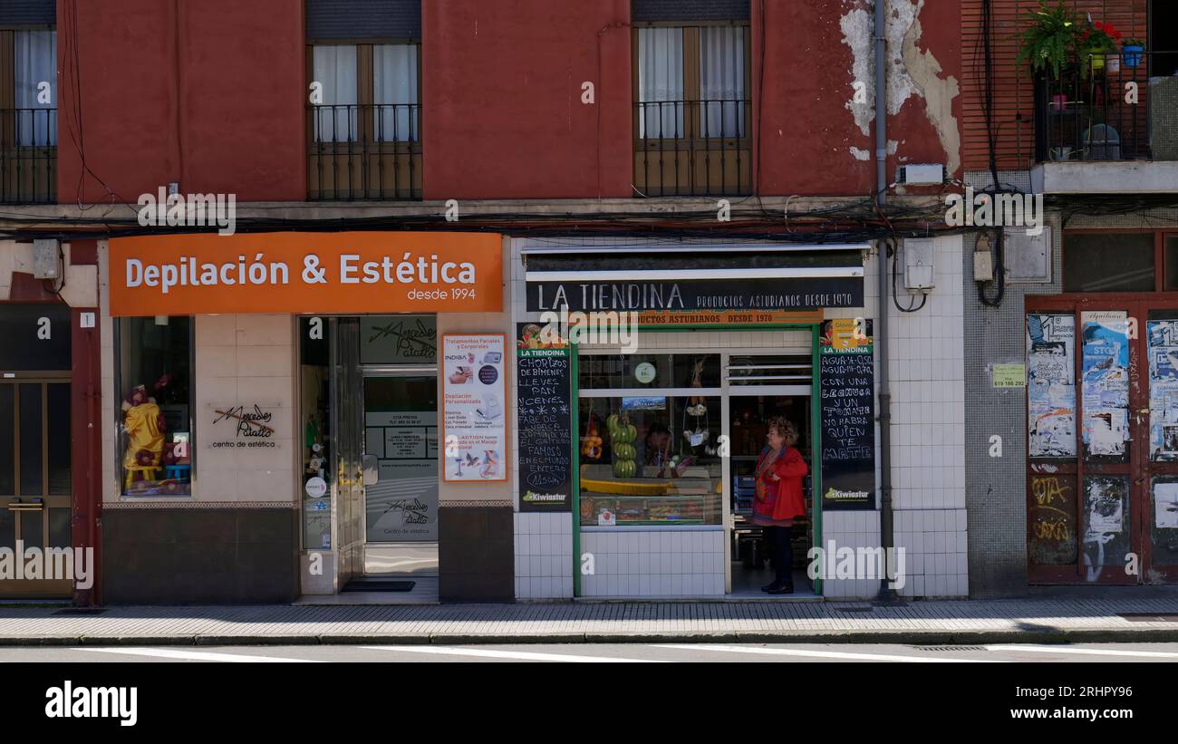 modern beauty salon shop next to old traditional fruit and vegetable ...