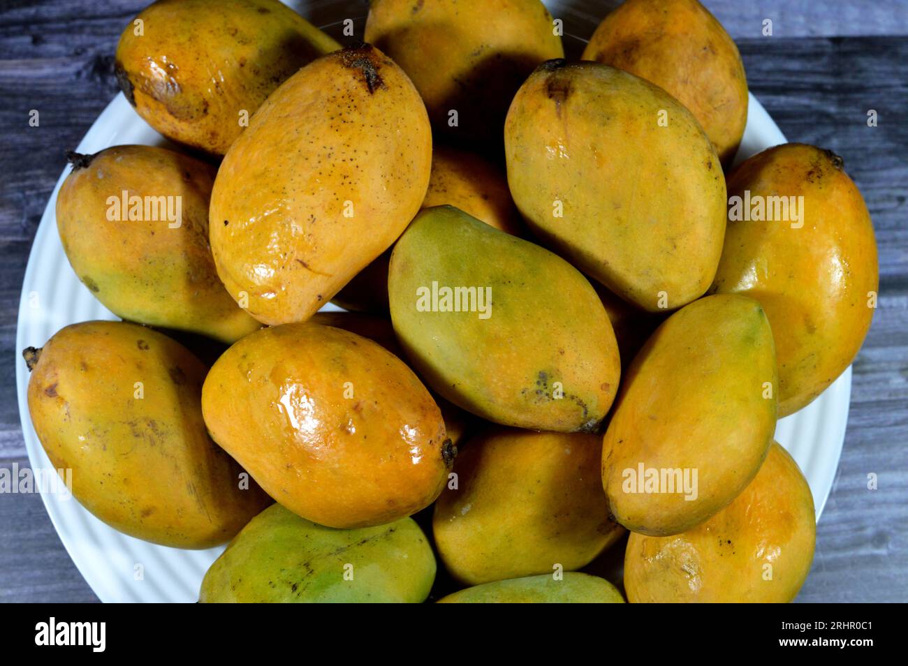 Plate of Egyptian fresh mango fruit with tropical delicacy, mangoes are ...
