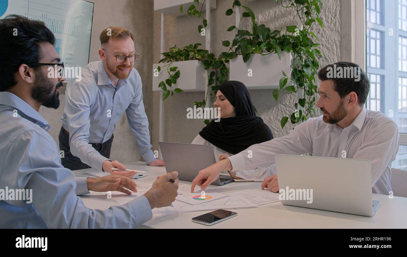 Team leader explain business project to colleagues in office boardroom ...