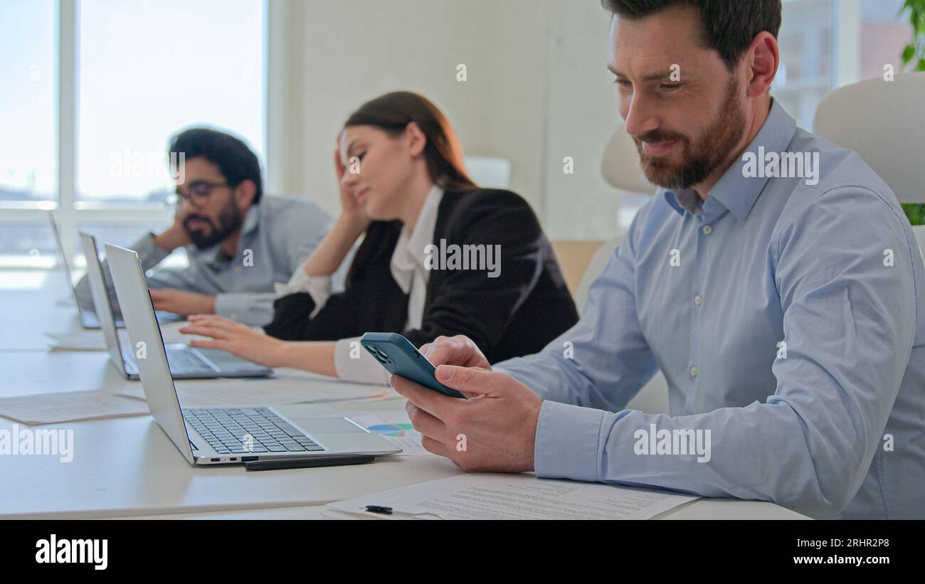 Multiracial business employees unmotivated staff sit at corporate ...