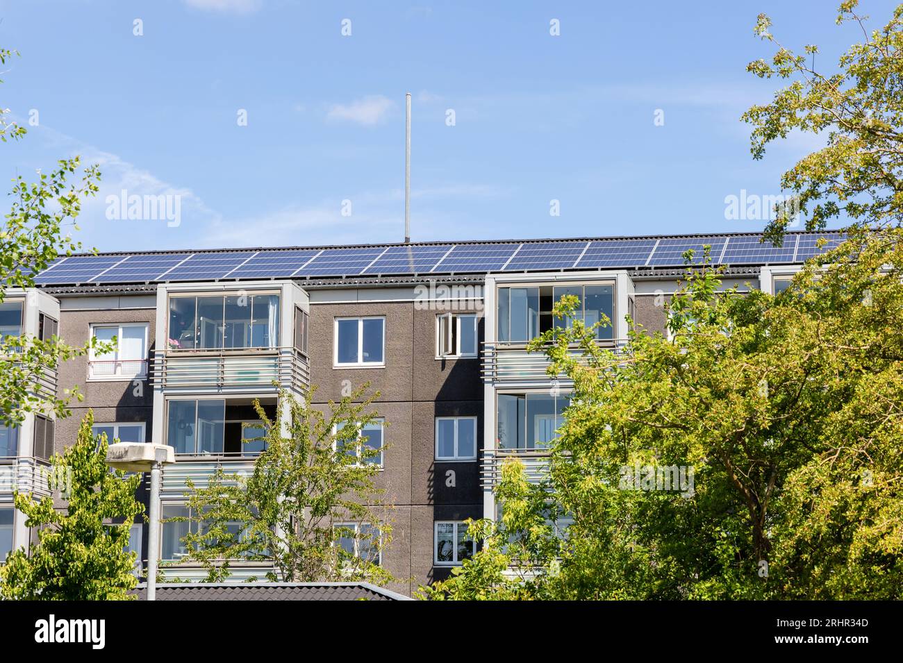 Residential building with new roof and solar panels. Real Estate ...