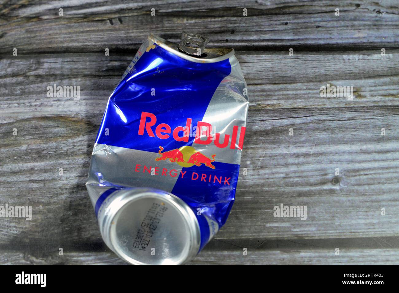 Cairo, Egypt, July 28 2023: Crushed dented Red Bull energy drink, a ...