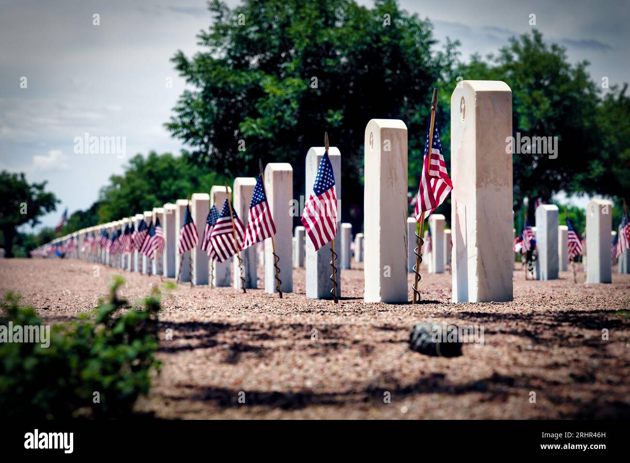 A sunny Memorial Day with flags flying on graves of American service ...