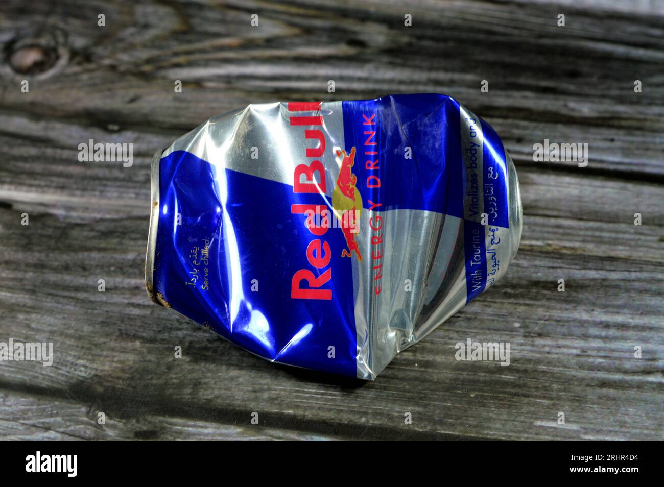 Cairo, Egypt, July 28 2023: Crushed dented Red Bull energy drink, a ...