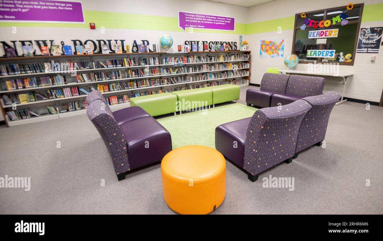 Books sit on shelves in an elementary school library in suburban ...