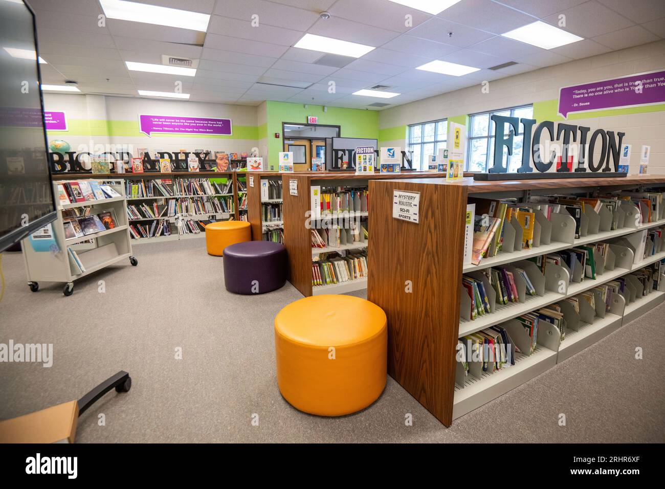 Books sit on shelves in an elementary school library in suburban ...