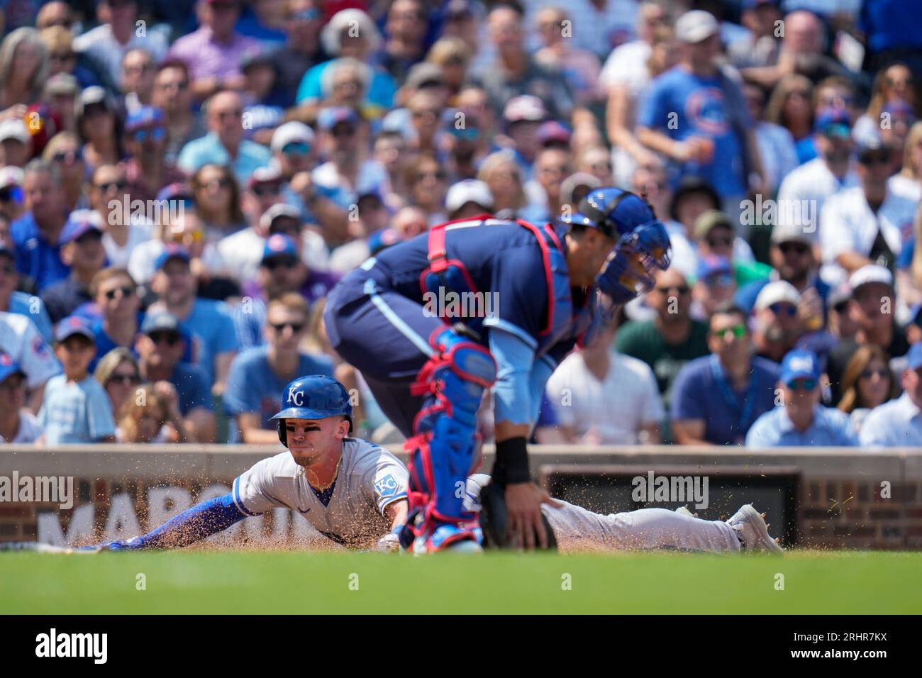 Kansas City Royals' Drew Waters dives safely into home base past ...