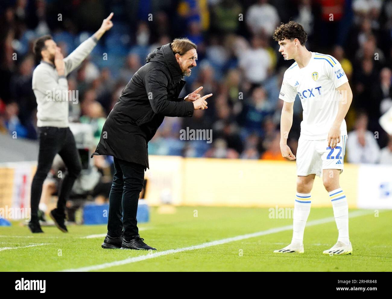 Leeds United manager Daniel Farke speaks to player Archie Gray (right ...