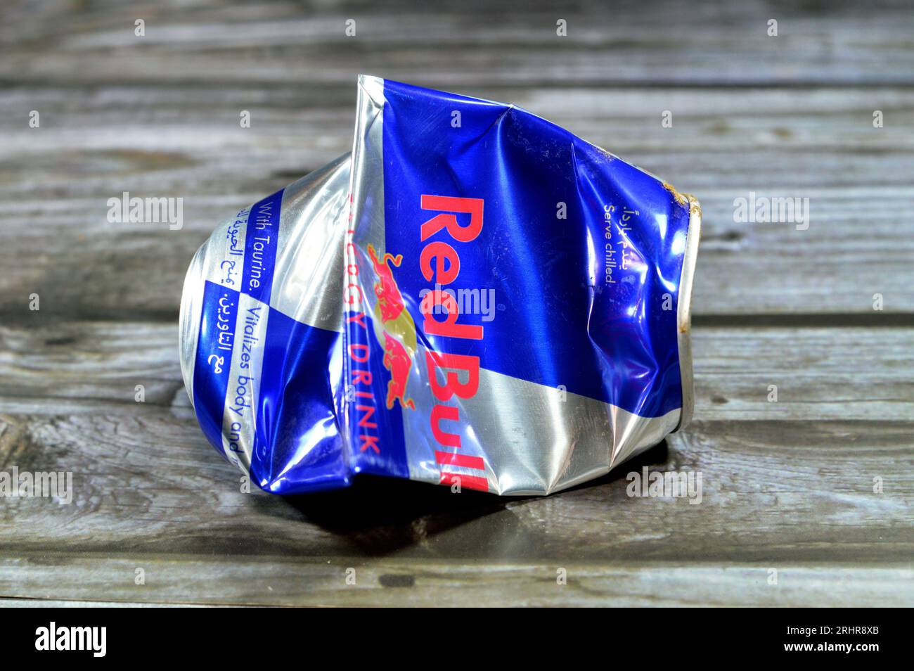 Cairo, Egypt, July 28 2023: Crushed dented Red Bull energy drink, a ...