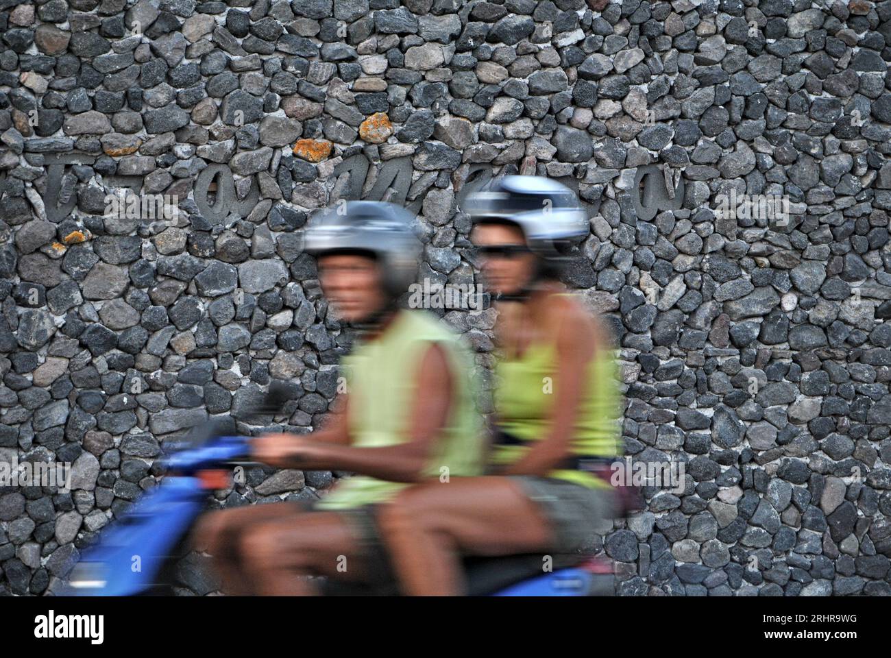 Man and woman - scooter moped roadtrip on greece island Santorini ...