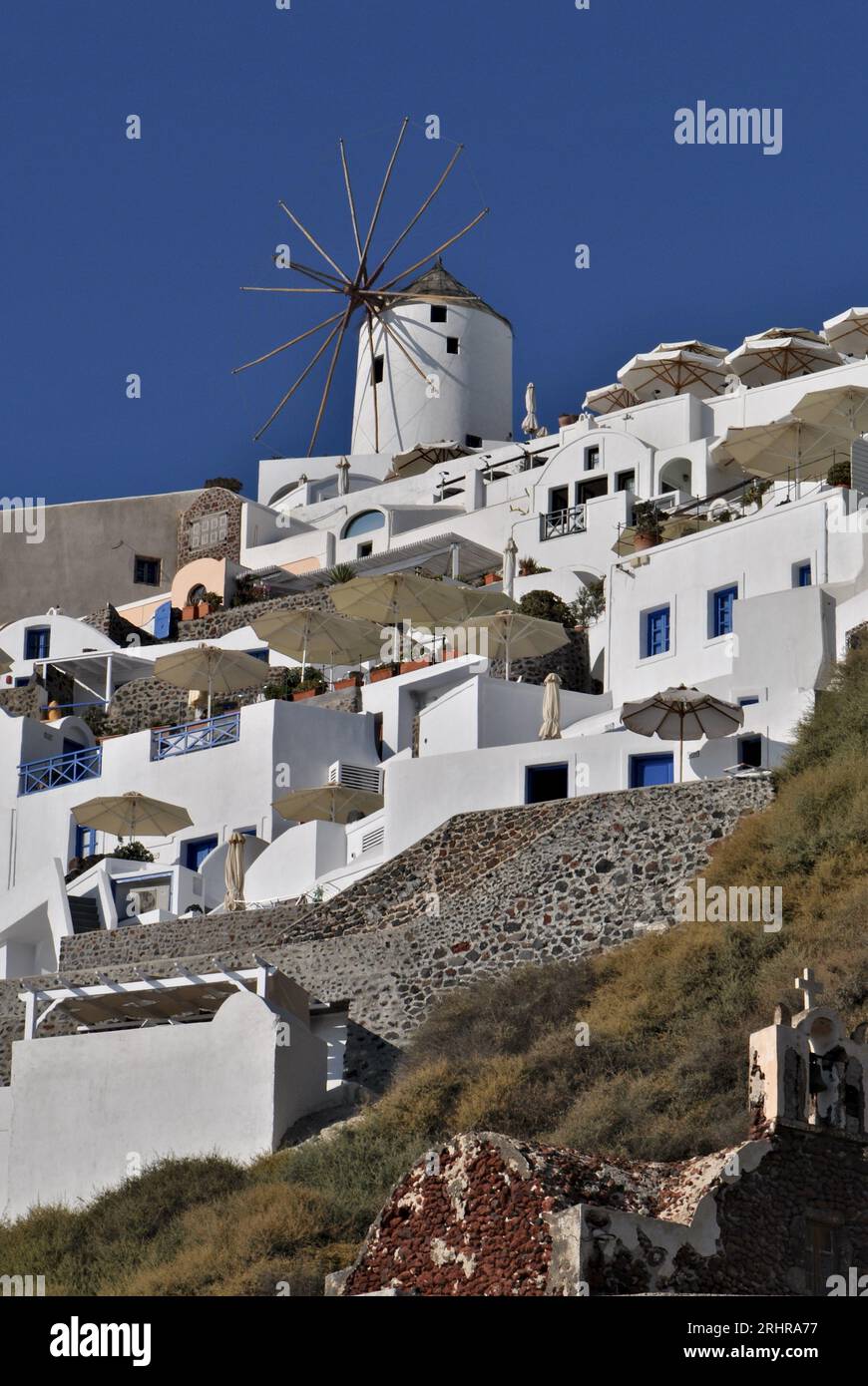 Windmills in Oia city on Santorini islands, Thera, Greece. One of the ...