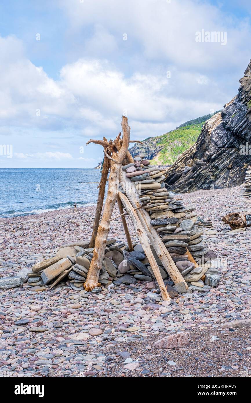 Visitors created an impromptu sculpture by balancing and stacking beach ...