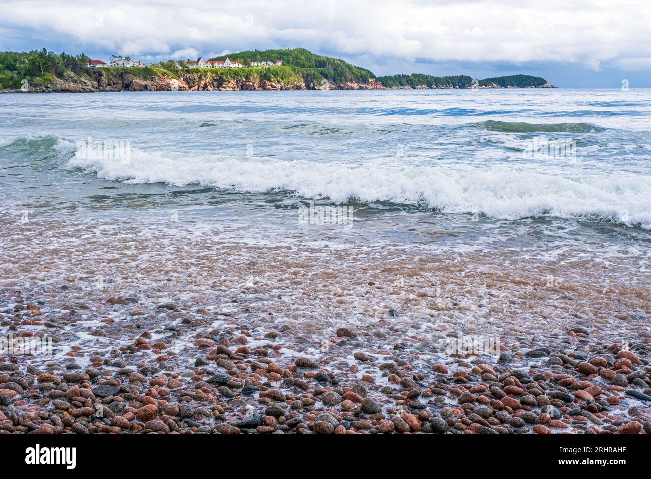 Waves crash onshore in the beautiful scene at Ingonish Beach Cape ...