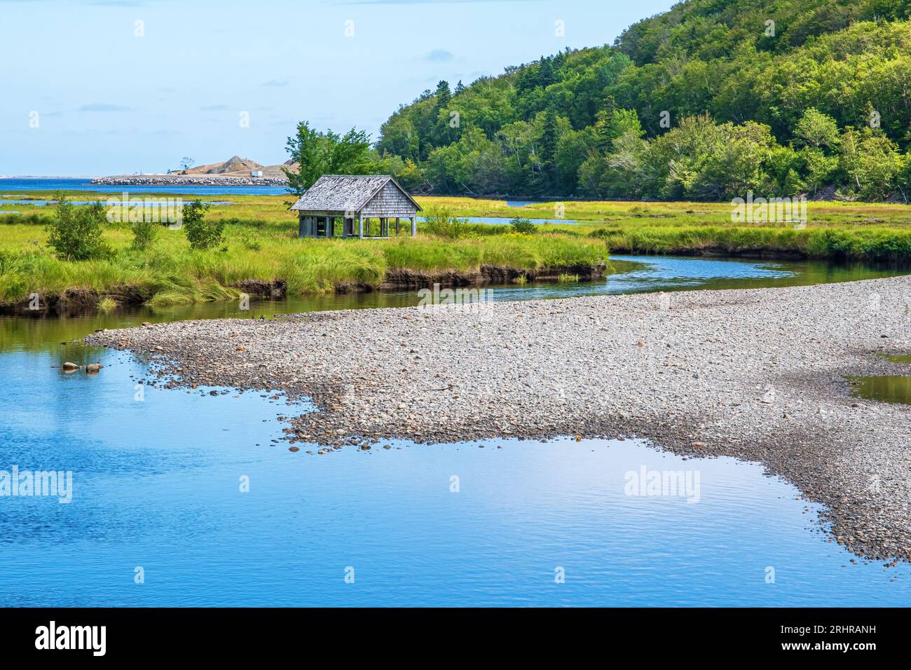 Old structure on a island at the mouth of the Ingonish River as it ...