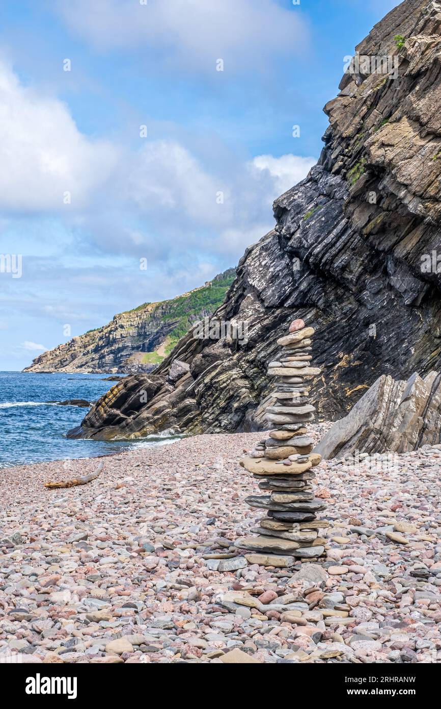 Visitors created an impromptu sculpture by balancing and stacking beach ...