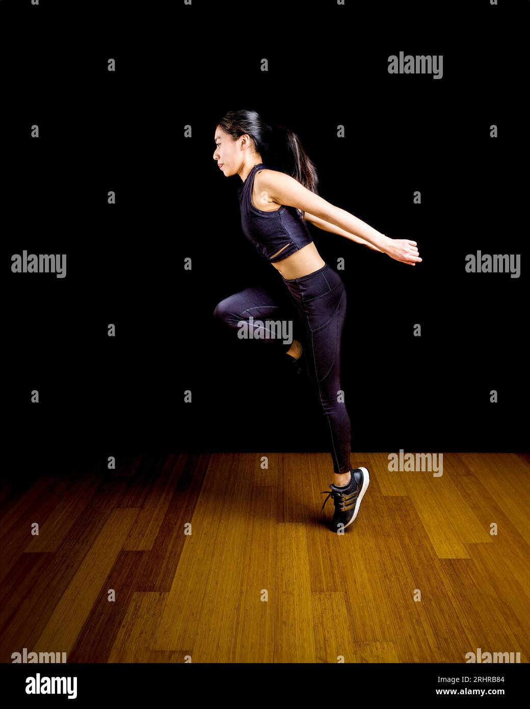 Young Asian Woman Lunging Studio Black Background Stock Photo - Alamy