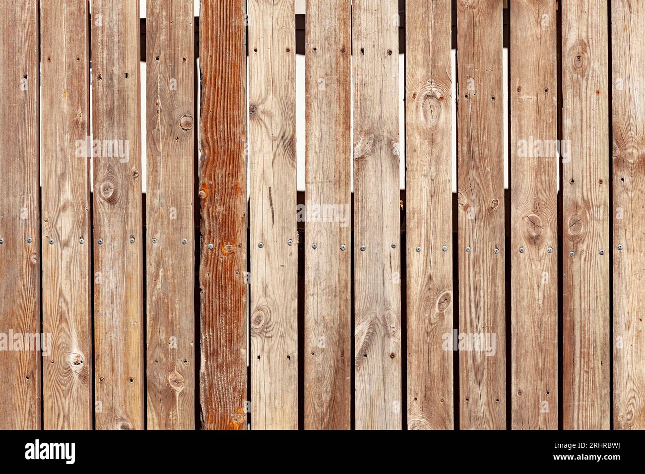 Vertical fence made of timber boards. Used wooden panels. Old hardwood ...