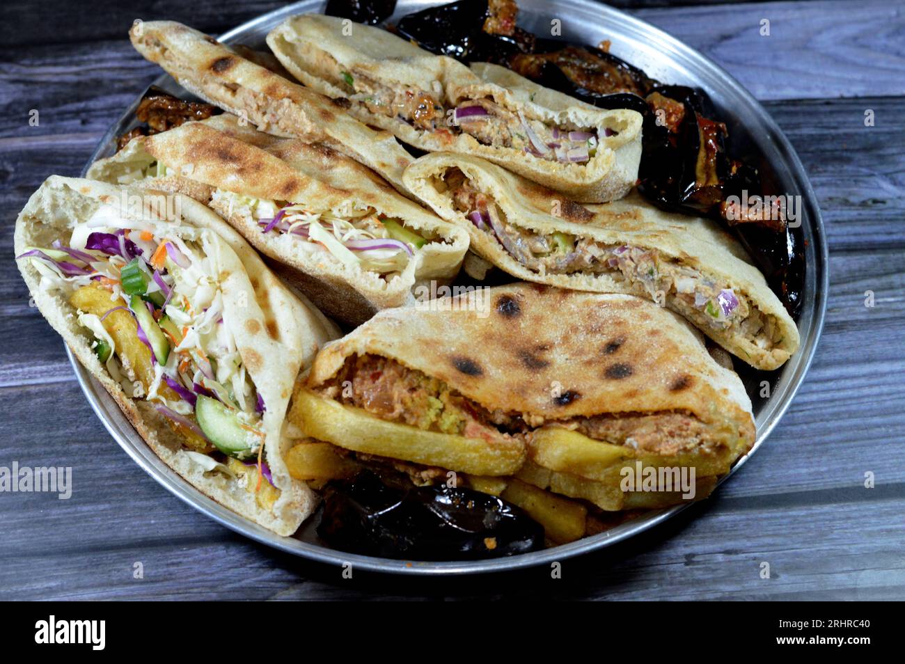 fried potatoes fingers sandwich and flat breads with mashed fava beans ...