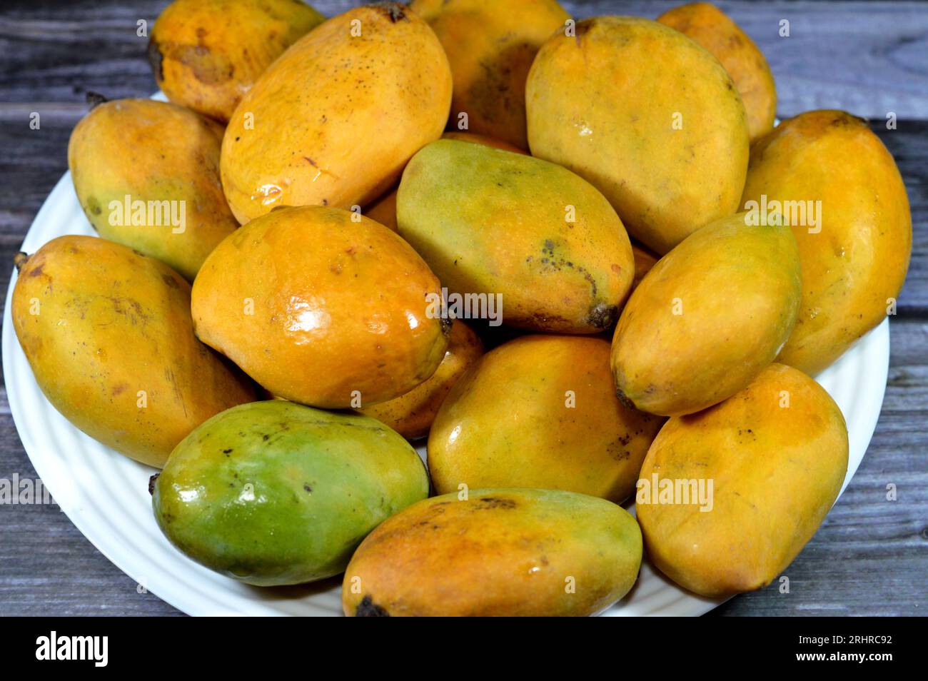 Plate of Egyptian fresh mango fruit with tropical delicacy, mangoes are ...