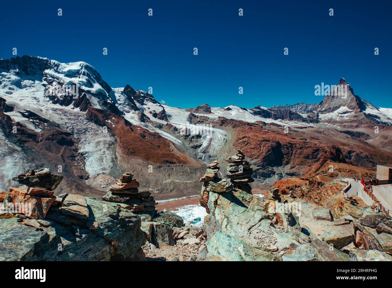 Stone pyramids in high Alps mountains with glacier Stock Photo - Alamy