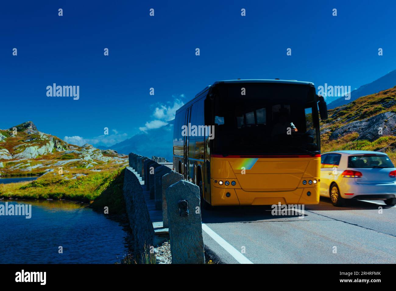 Alps road with passenger bus and car Stock Photo - Alamy