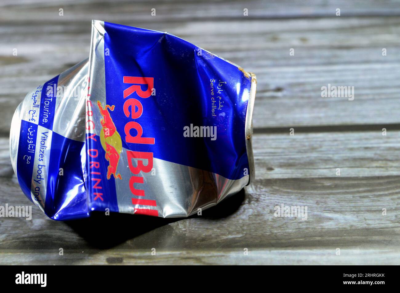 Cairo, Egypt, July 28 2023: Crushed dented Red Bull energy drink, a ...