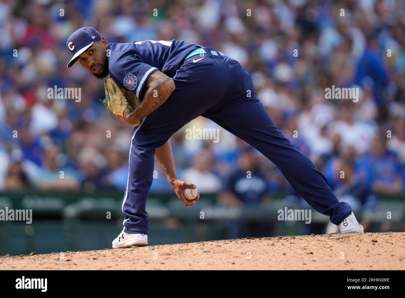 Chicago Cubs relief pitcher Jose Cuas looks over his shoulder before ...